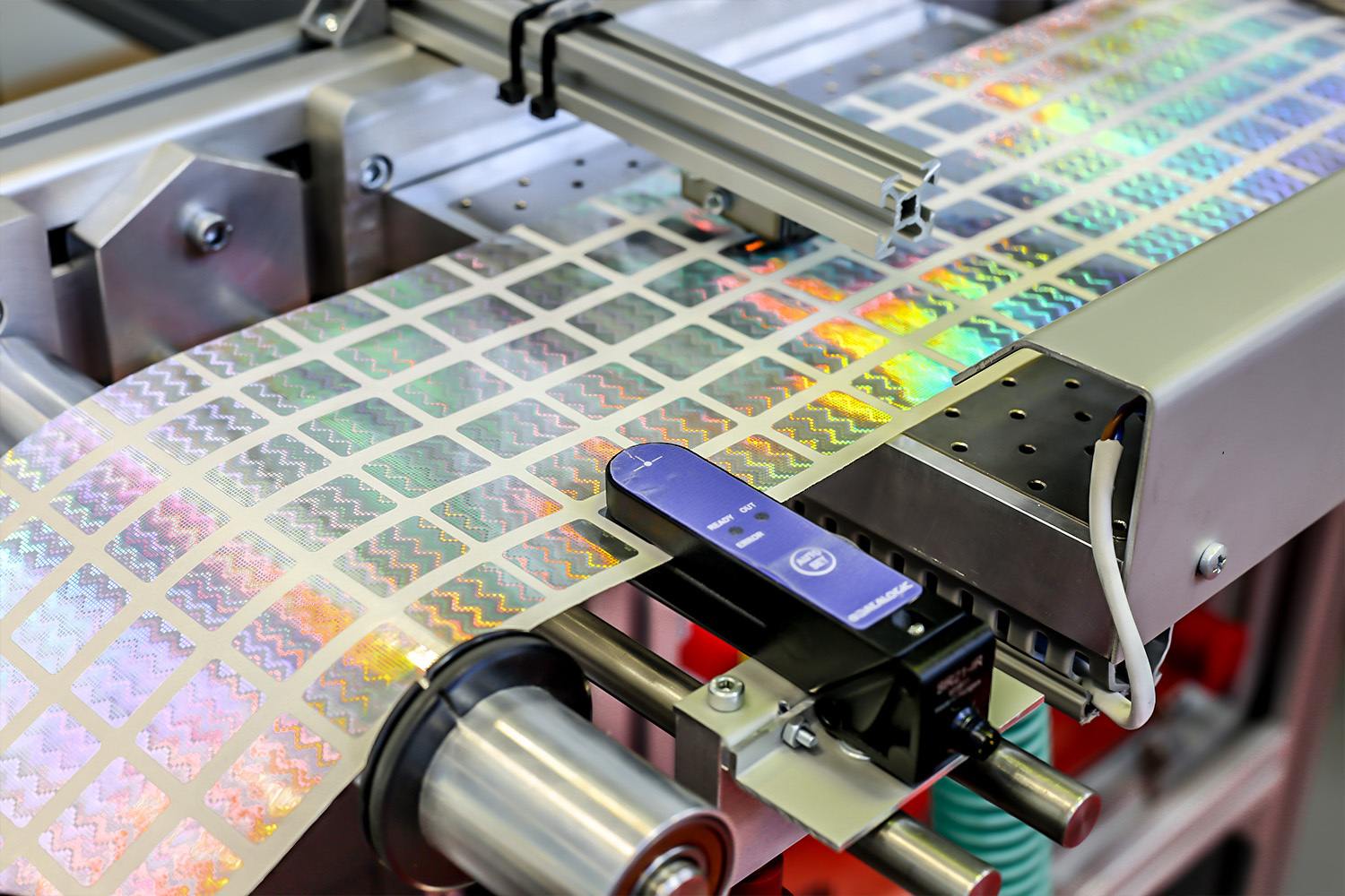 Laser marking of holographic labels